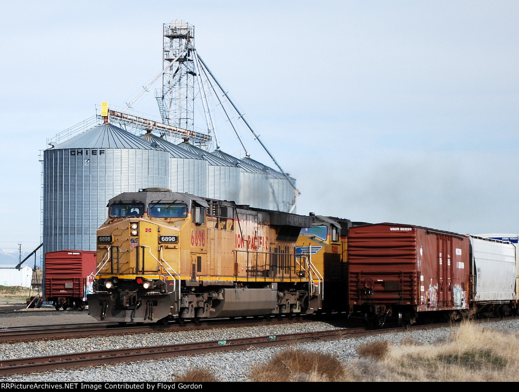 UP 6898 leads eastbound ballast hopper train